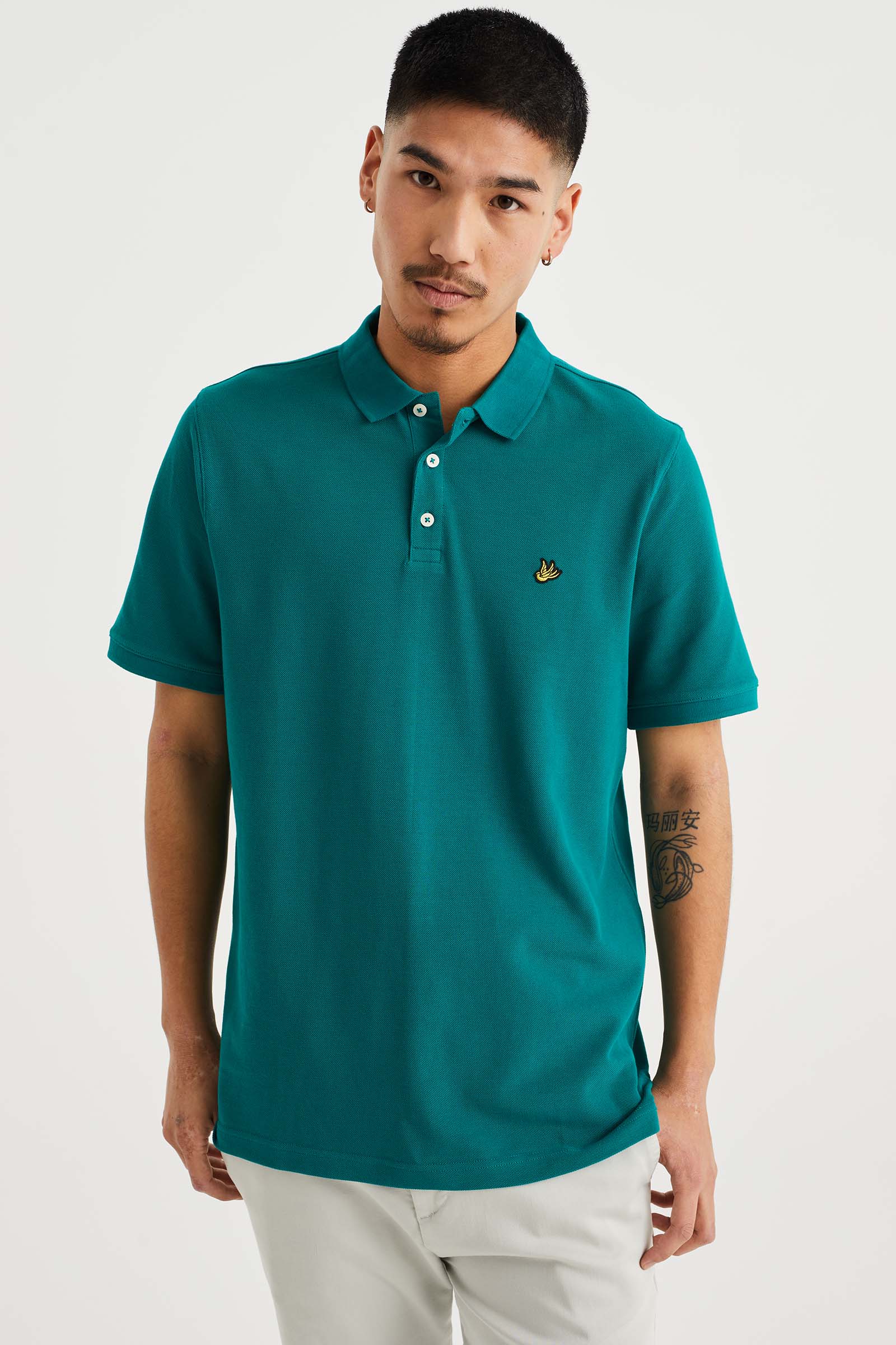 Polo slim fit homme à structure avec broderie | wefashion.com